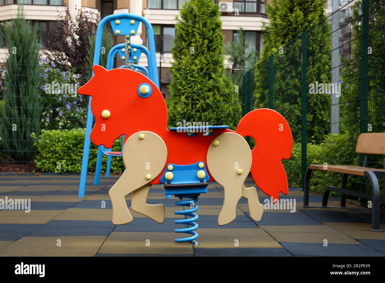 Empty horse spring rider on children's playground in residential area ...
