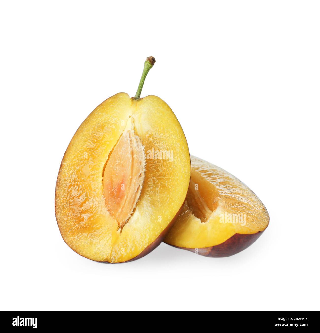 Fresh cut ripe plum on white background Stock Photo - Alamy