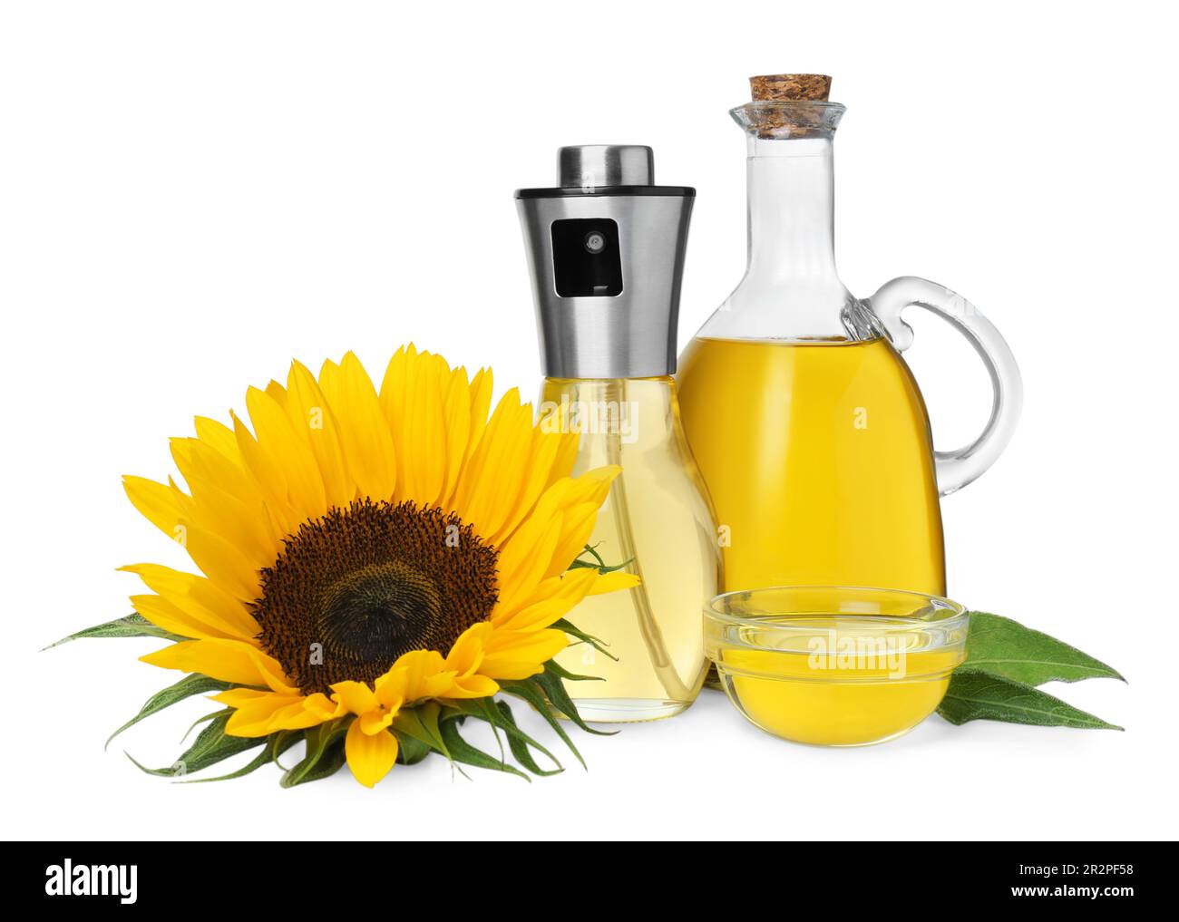 Cooking oil and sunflower on white background Stock Photo - Alamy