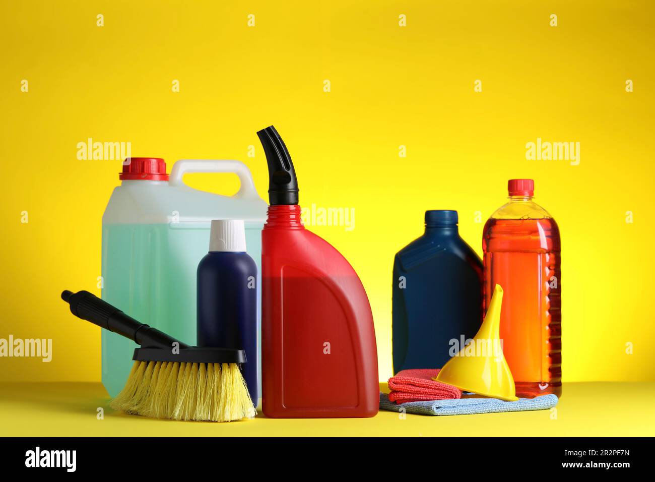 Different car cleaning products on yellow background Stock Photo - Alamy