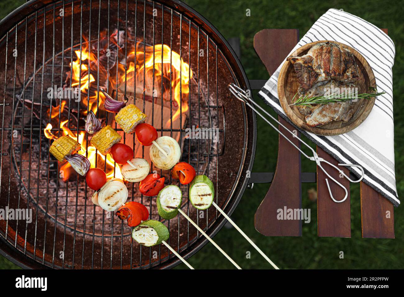 Cooked food products and grill barbecue outdoors, top view Stock Photo ...
