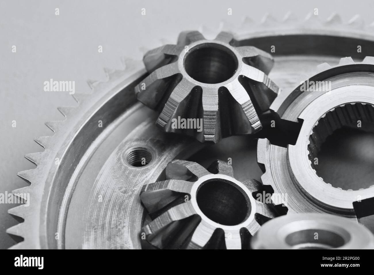 Different stainless steel gears on light grey background, top view ...