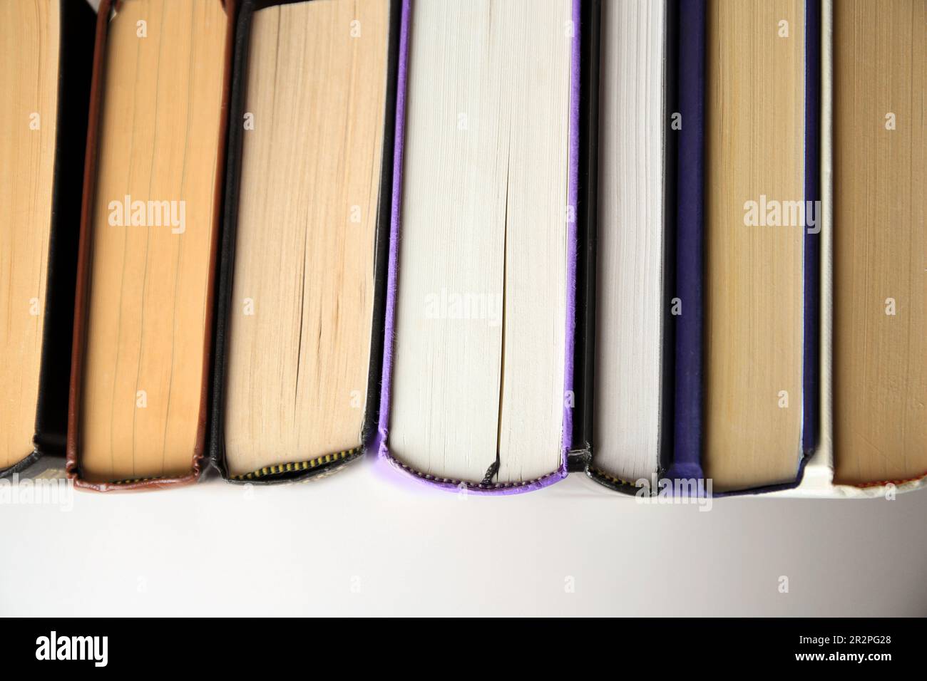 Collection of different books on white shelf, top view Stock Photo - Alamy