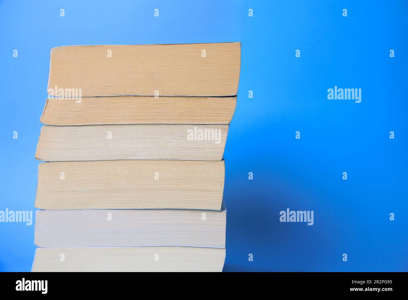 Collection of books on light blue background, space for text Stock ...