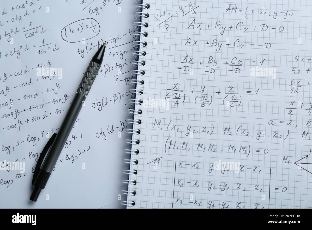 Paper with different mathematical formulas and pen, top view Stock ...