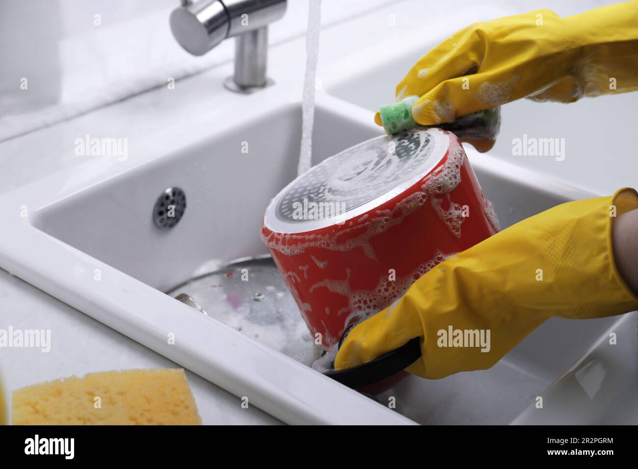 Woman washing dirty dishes in kitchen sink, closeup Stock Photo - Alamy