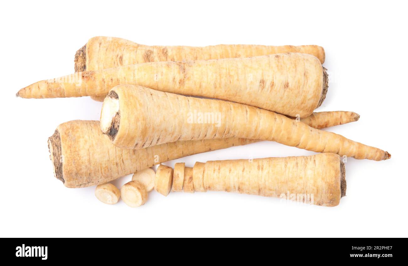 Raw parsley roots isolated on white, top view Stock Photo - Alamy