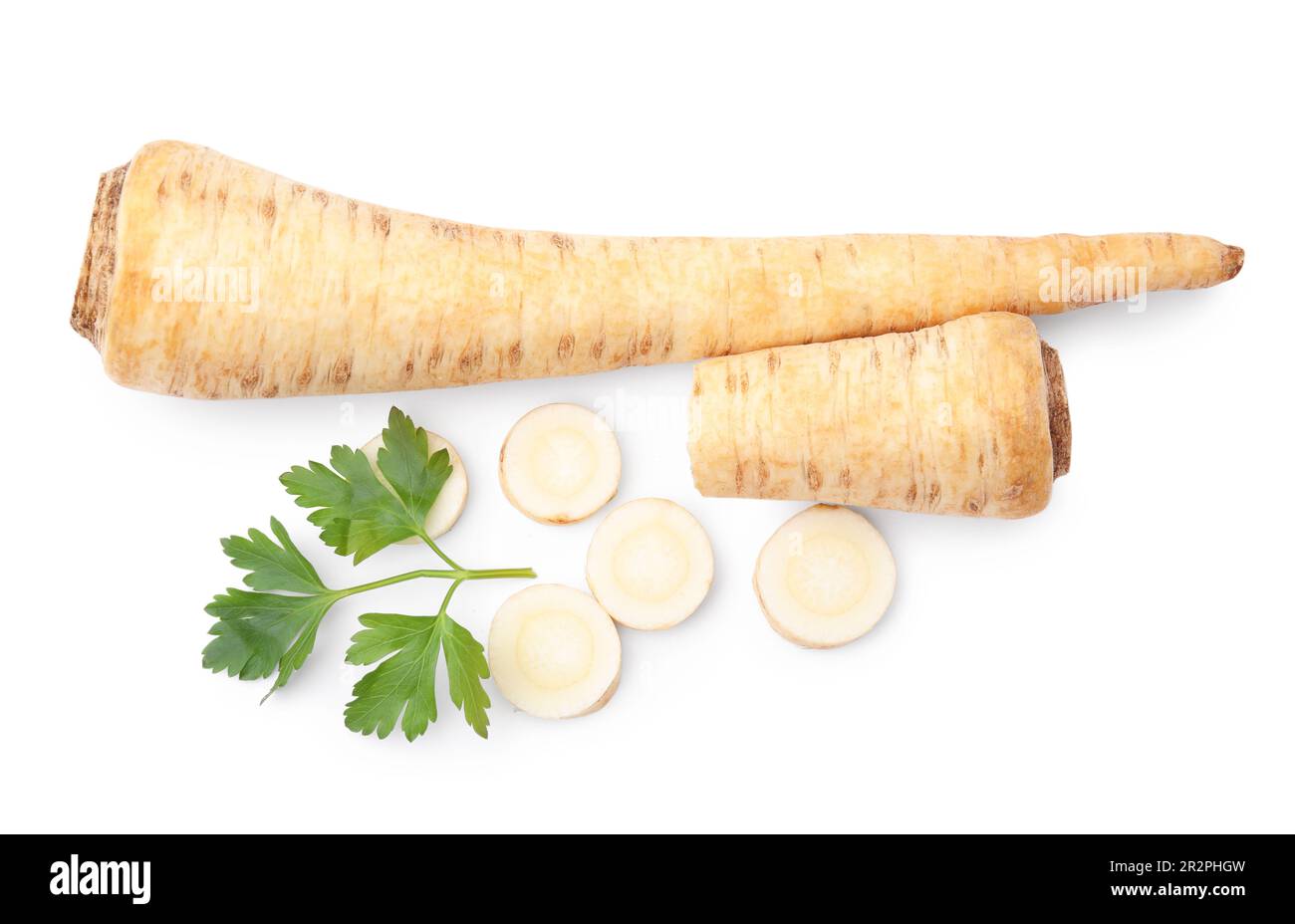 Whole and cut raw parsley roots, fresh herb isolated on white, top view ...