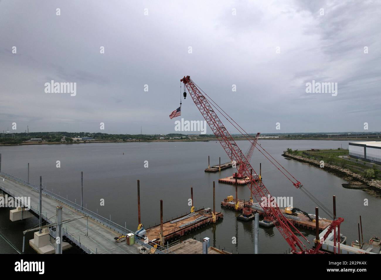 American Flag flying off a crane at the site of the new River Draw ...