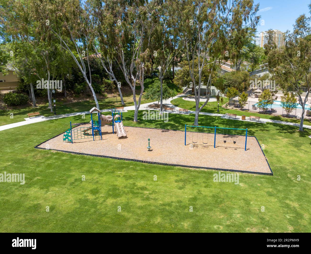 Aerial view of recreational facilities with kids playgorund in private ...