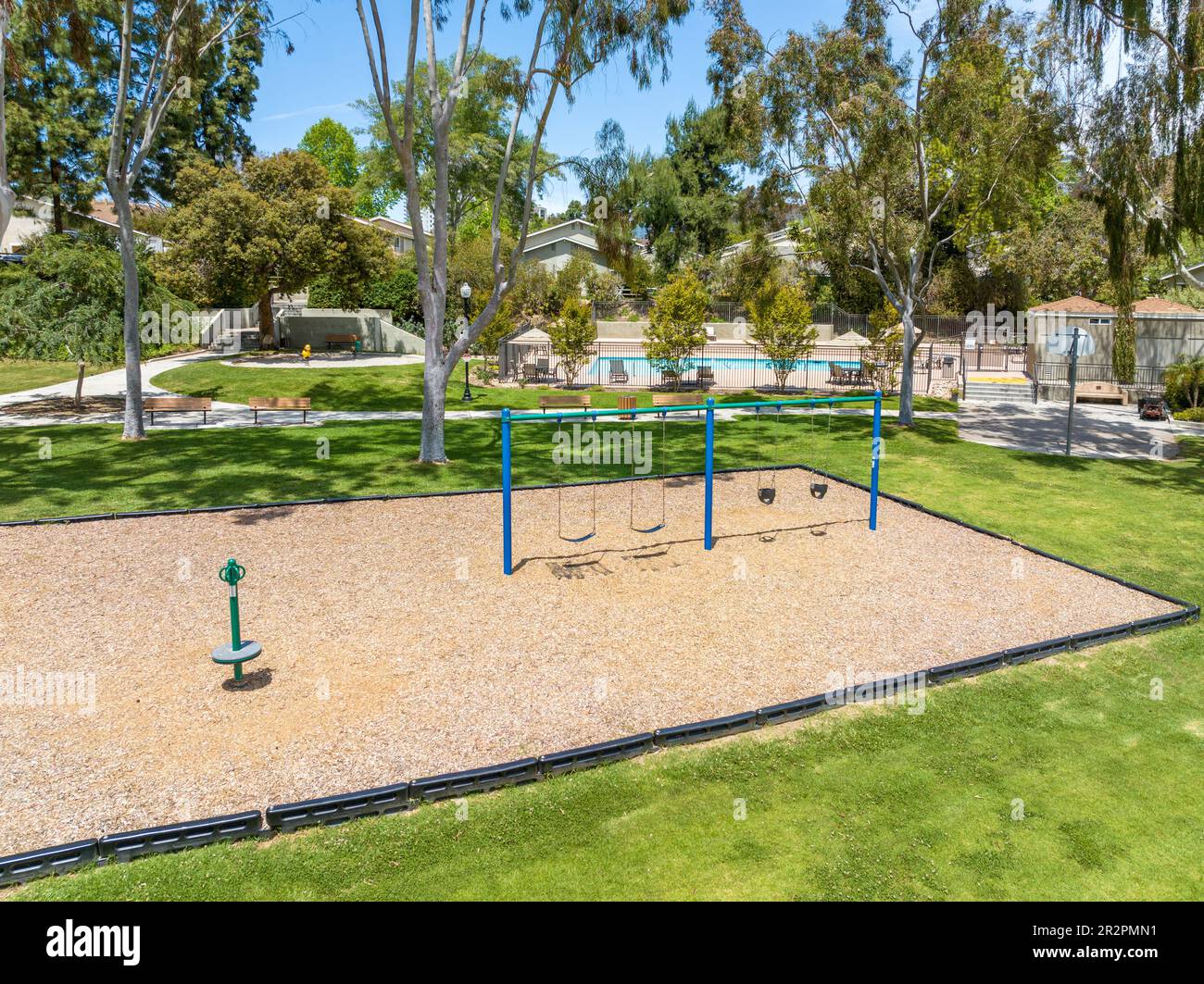 Aerial view of recreational facilities with kids playgorund in private ...