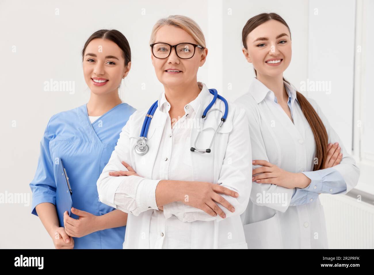 Portrait of medical doctors wearing uniforms indoors Stock Photo - Alamy