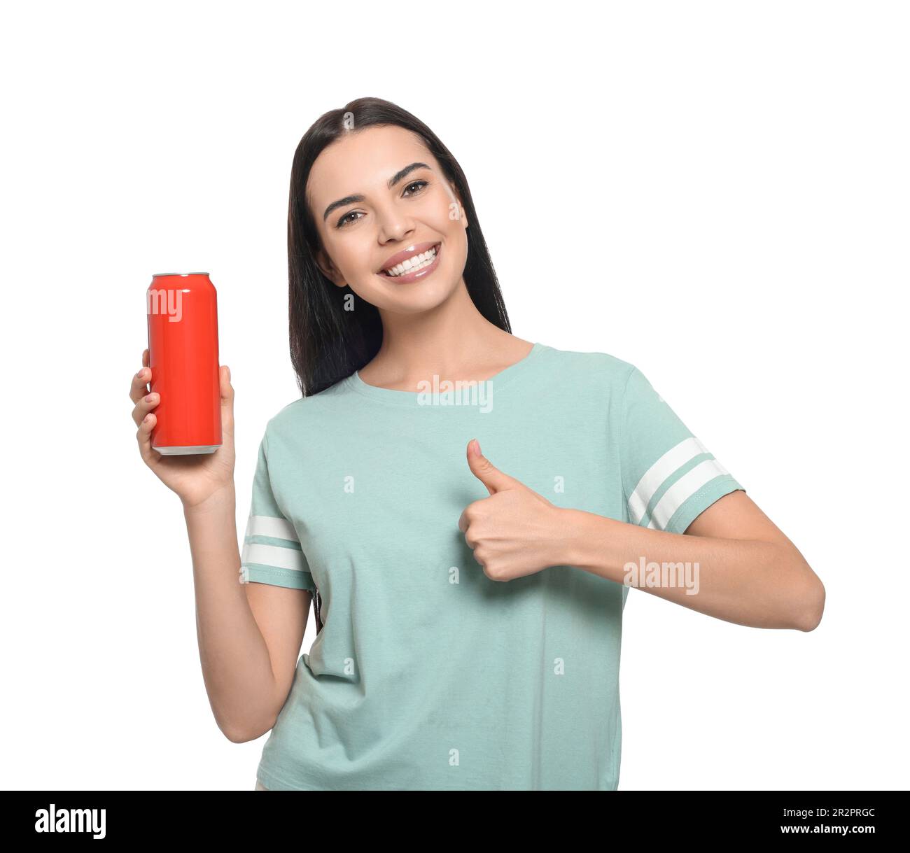 Beautiful happy woman holding red beverage can and showing thumbs up on ...