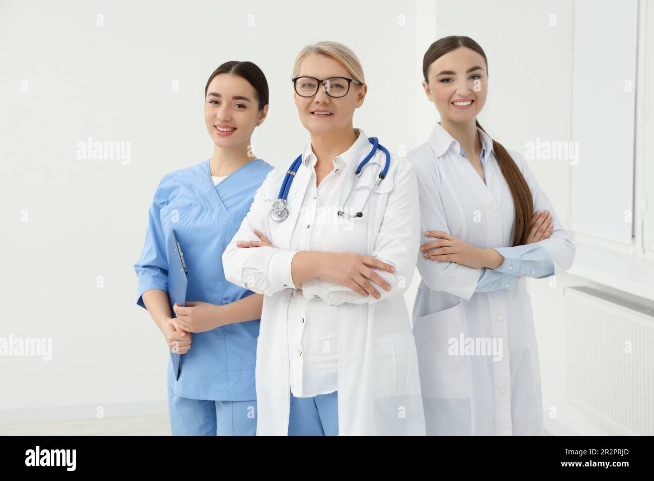 Portrait of medical doctors wearing uniforms indoors Stock Photo - Alamy