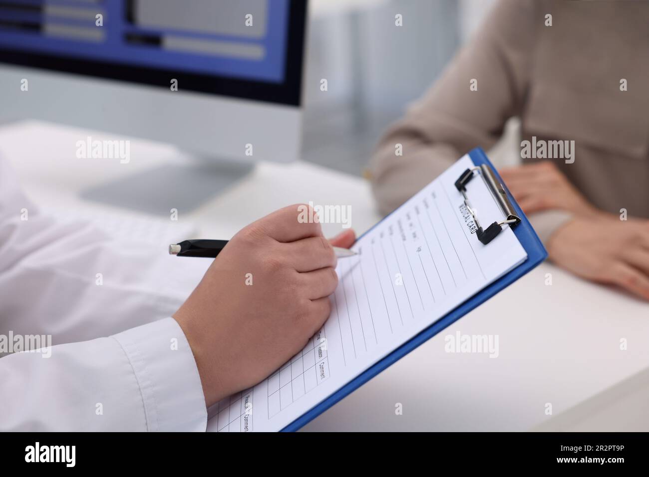 Female doctor hands filling out hi-res stock photography and images - Alamy