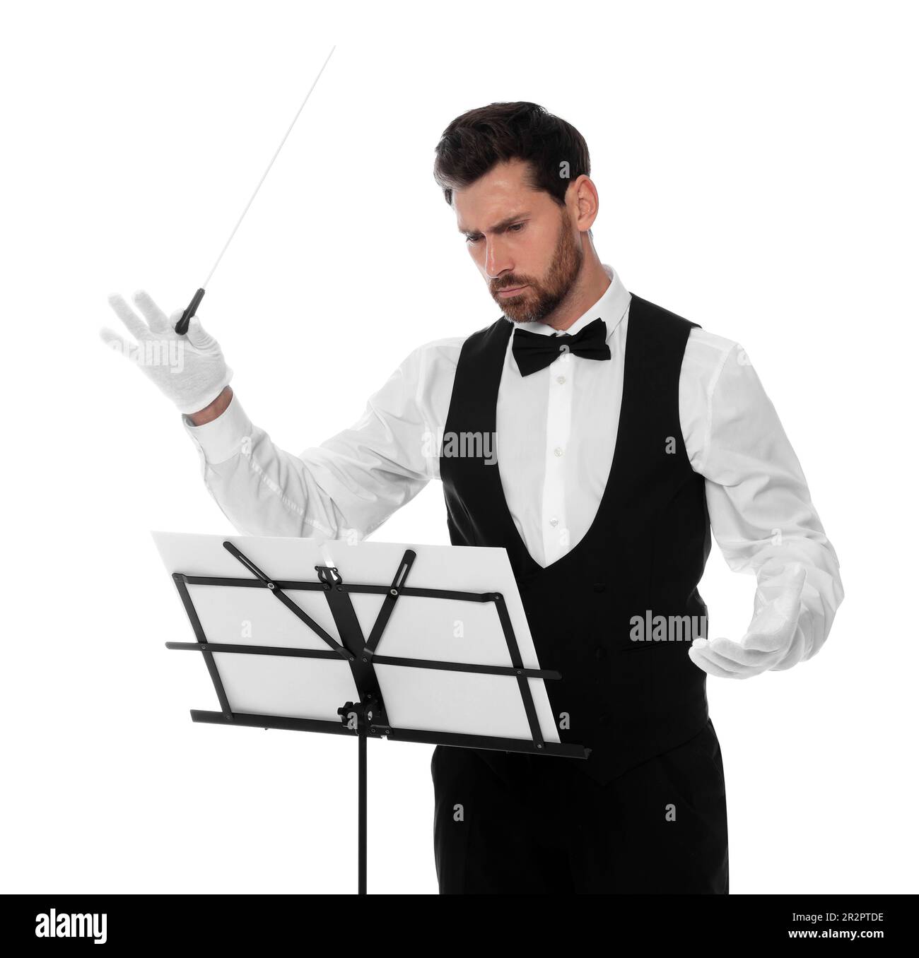 Professional conductor with baton and note stand on white background ...