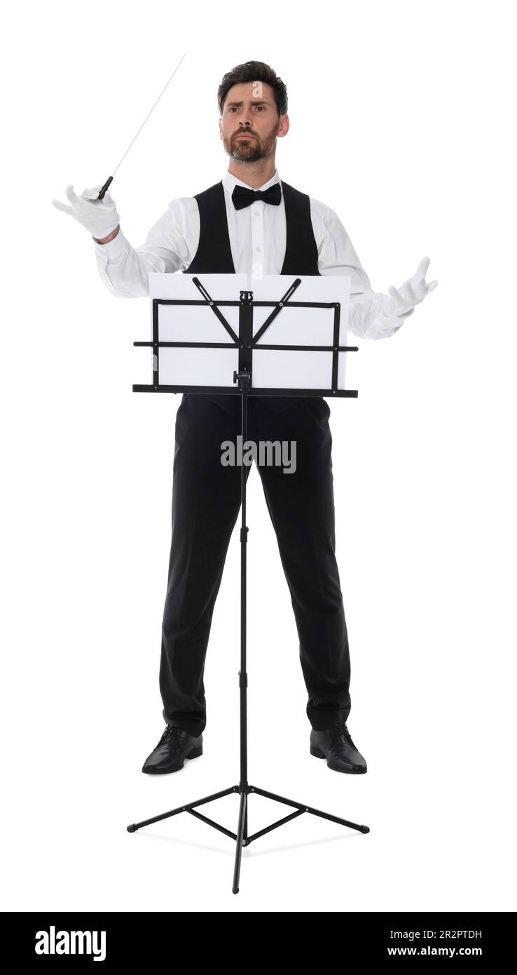 Professional conductor with baton and note stand on white background ...