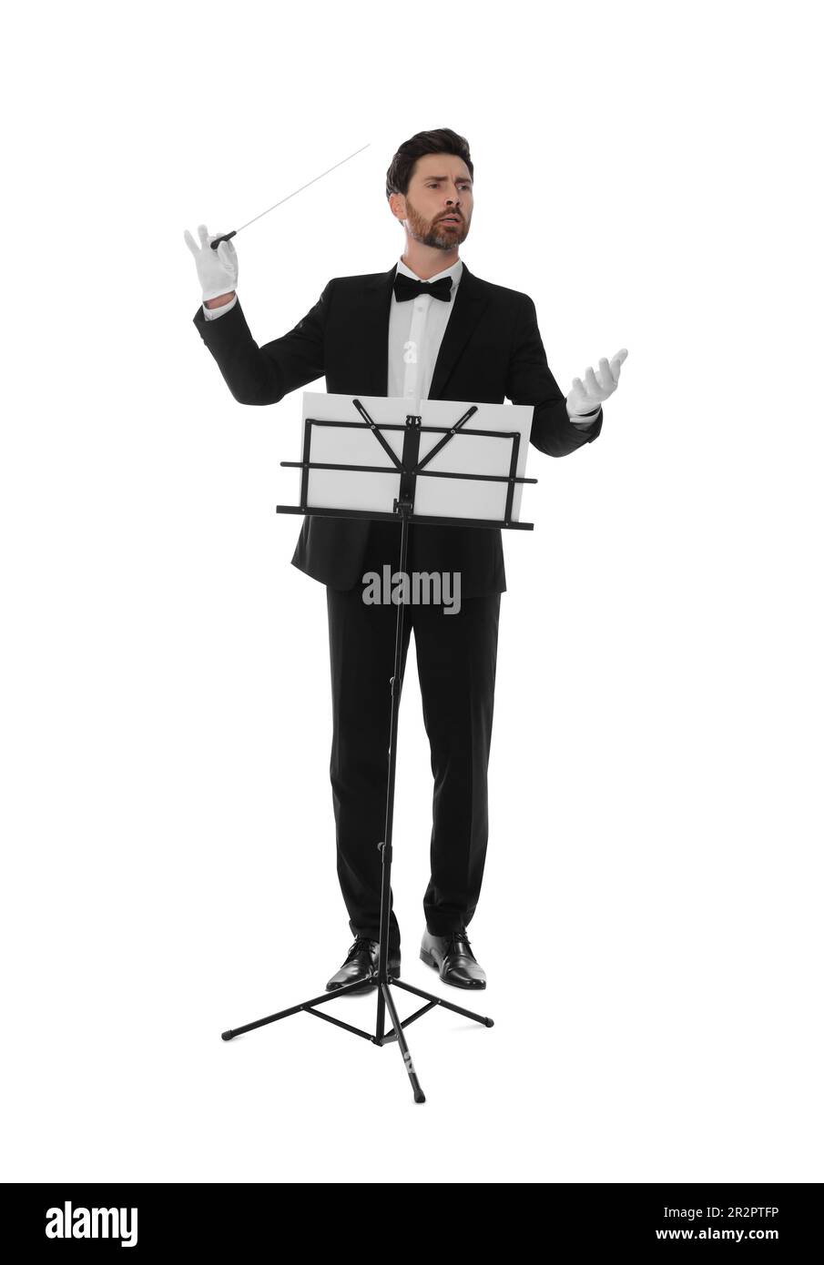 Professional conductor with baton and note stand on white background ...