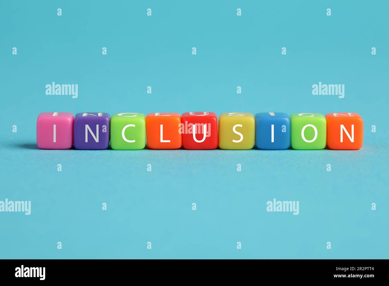 Colorful cubes with word Inclusion on light blue background Stock Photo ...