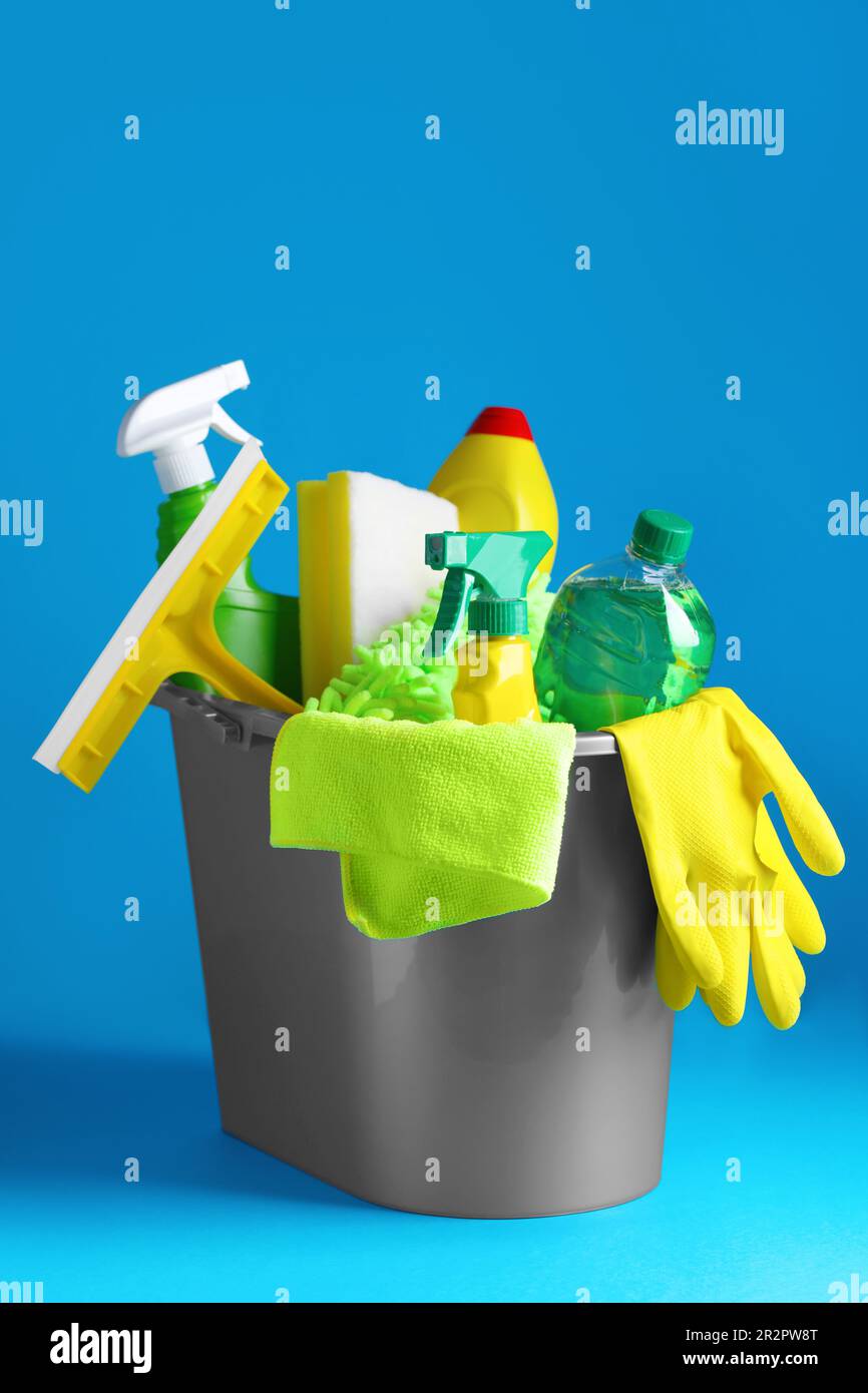 Different car products in bucket on light blue background Stock Photo ...