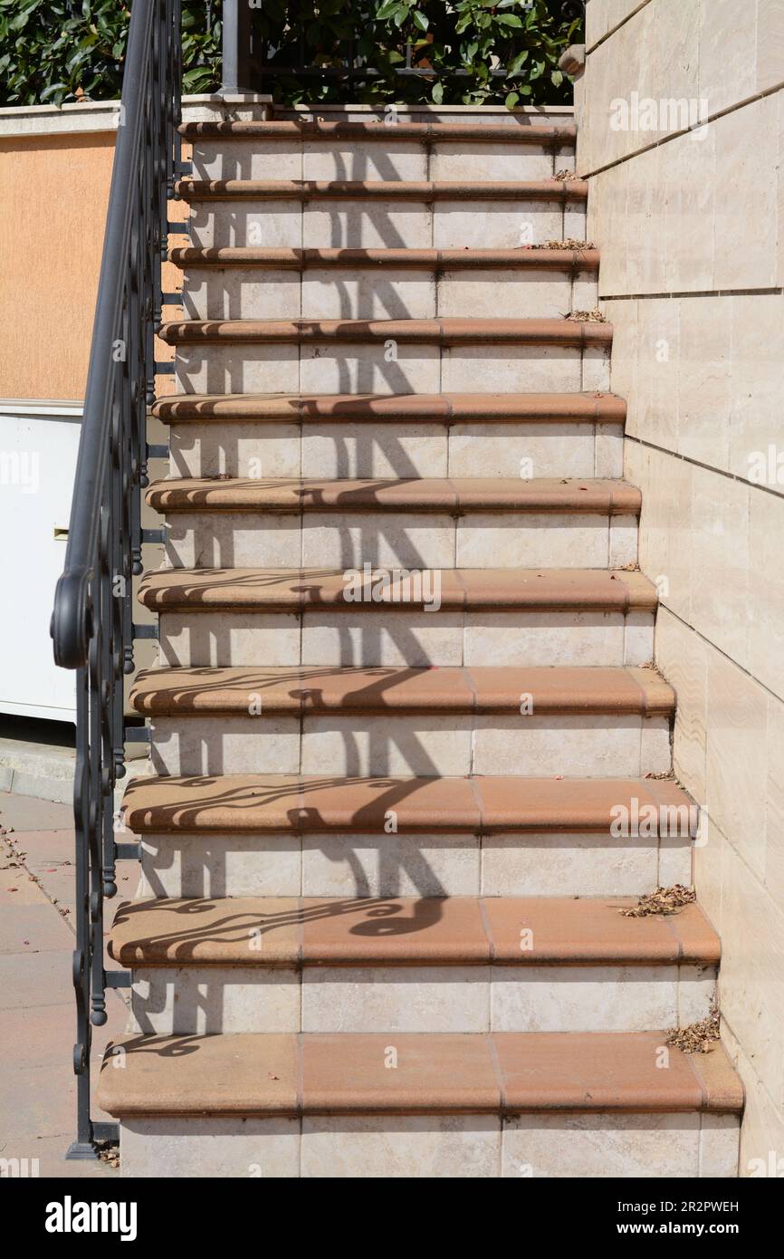 Beautiful tiled stairs with metal railings outdoors Stock Photo - Alamy