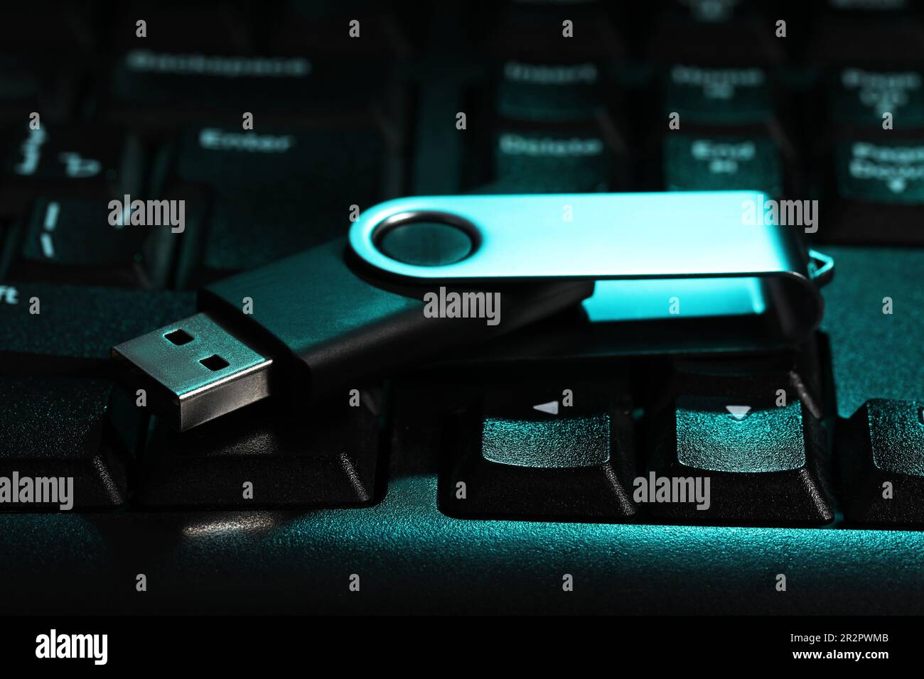 Modern usb flash drive on laptop keyboard, closeup Stock Photo - Alamy