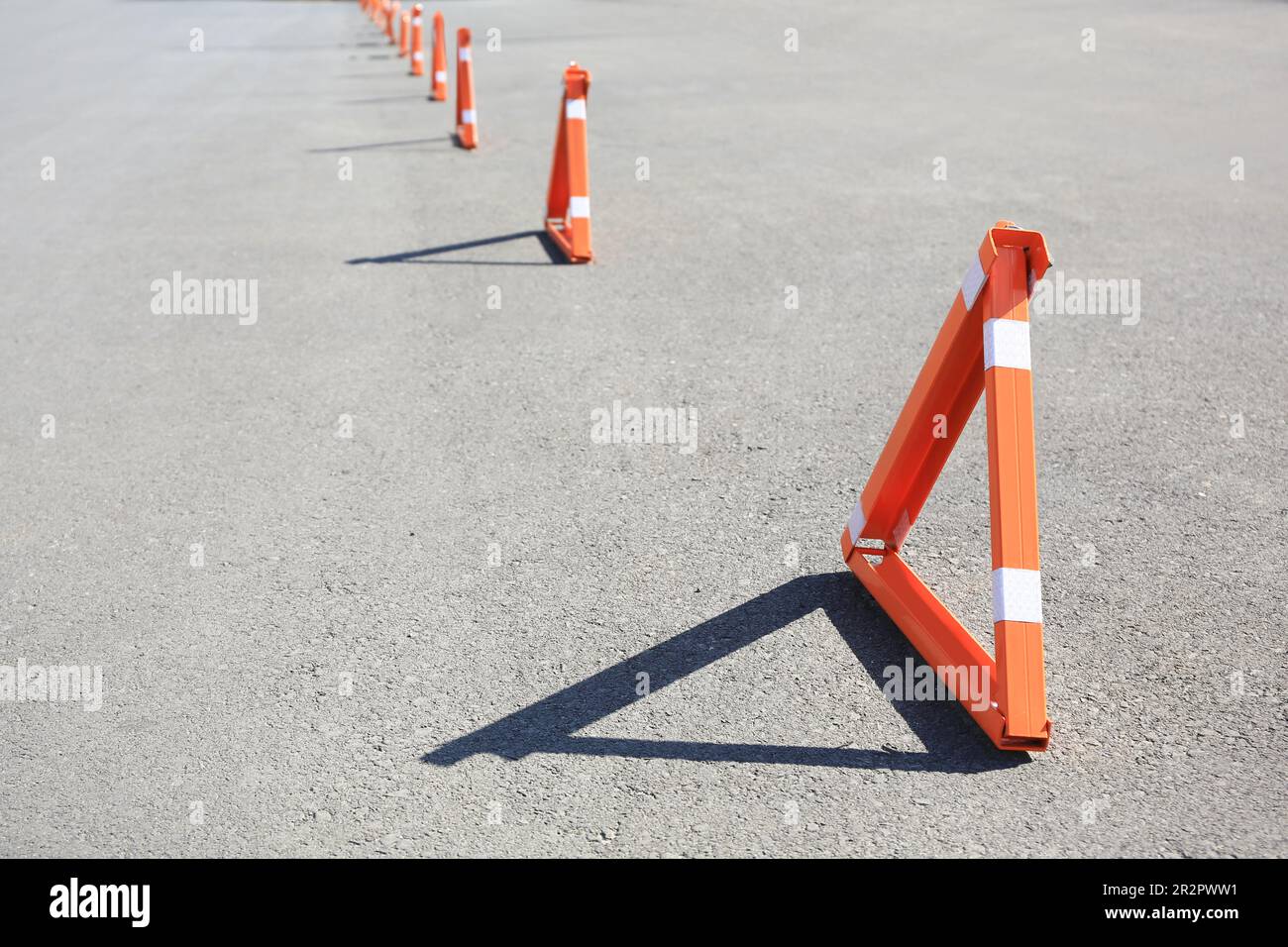 Triangular parking barriers on asphalt outdoors. Space for text Stock ...
