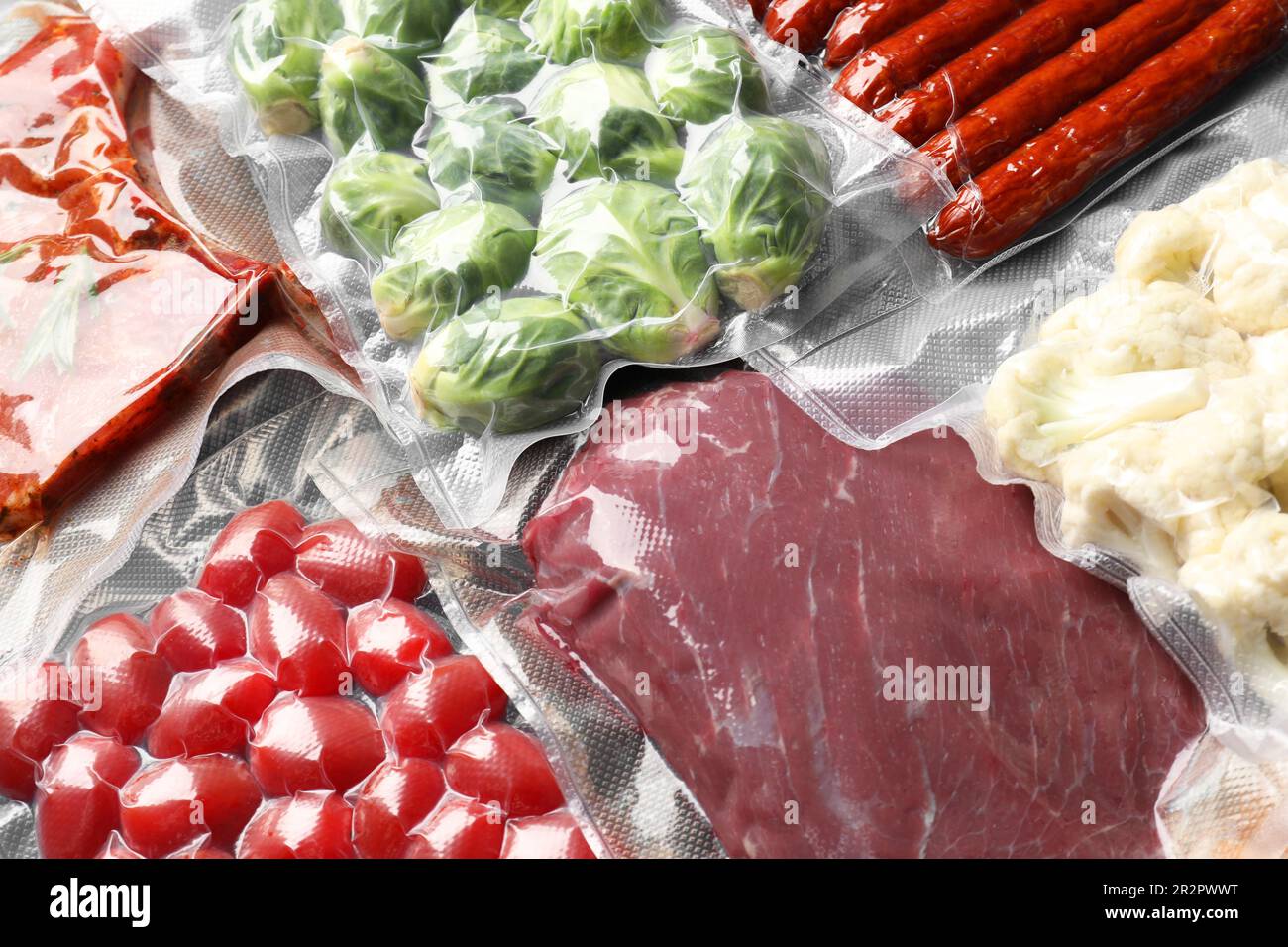 Many different food in vacuum packings as background, closeup Stock ...