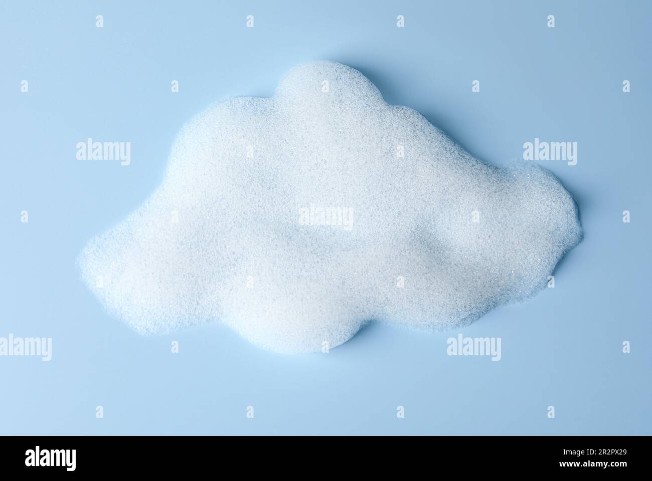 Foam sample in shape of cloud on light blue background, top view Stock ...