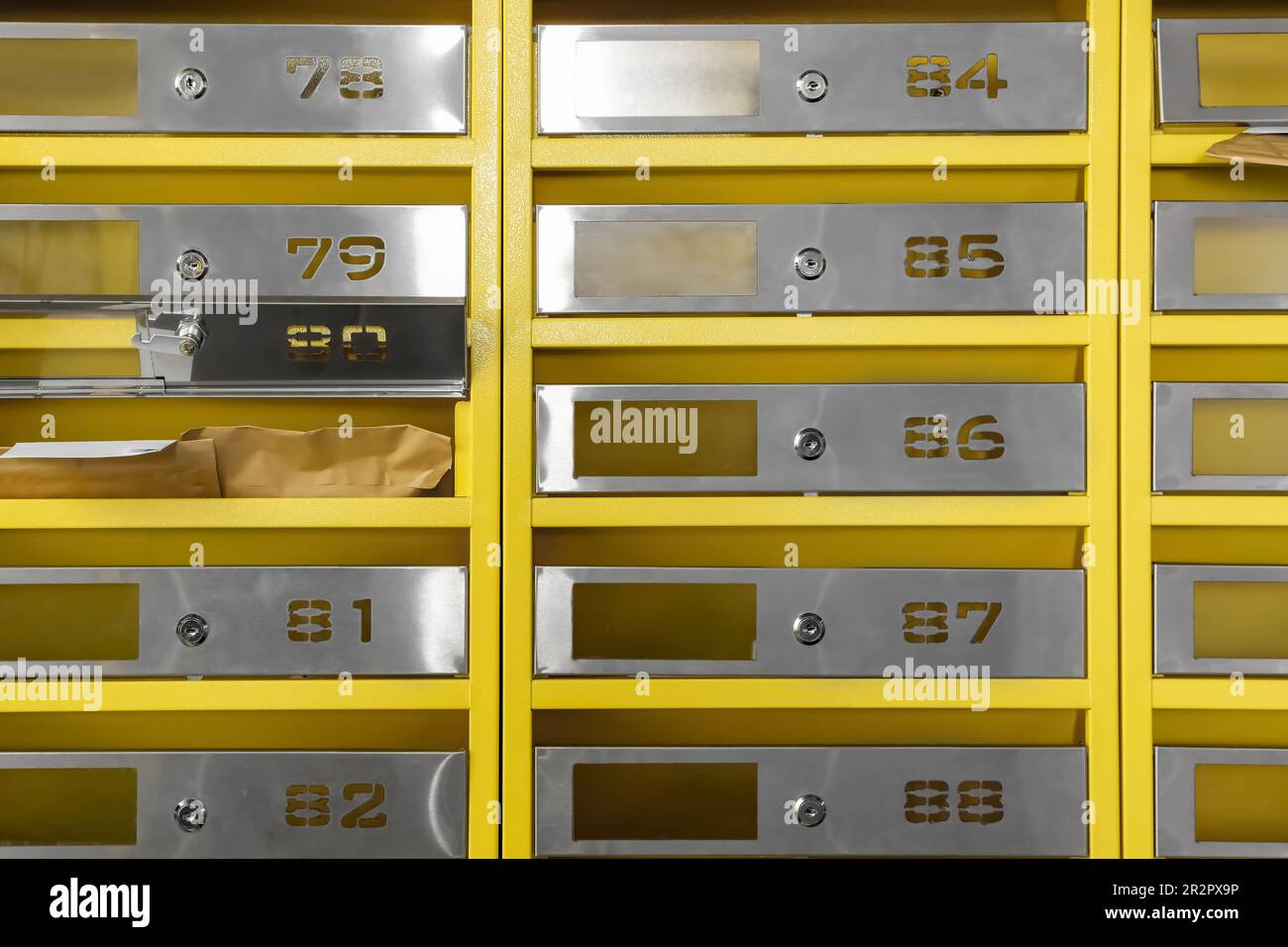 Metal mailboxes with keyholes, numbers and correspondence in post ...