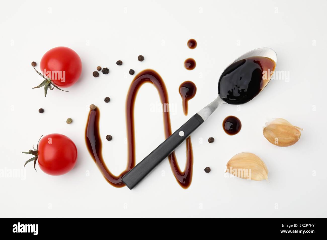 Organic balsamic vinegar and cooking ingredients on white background ...