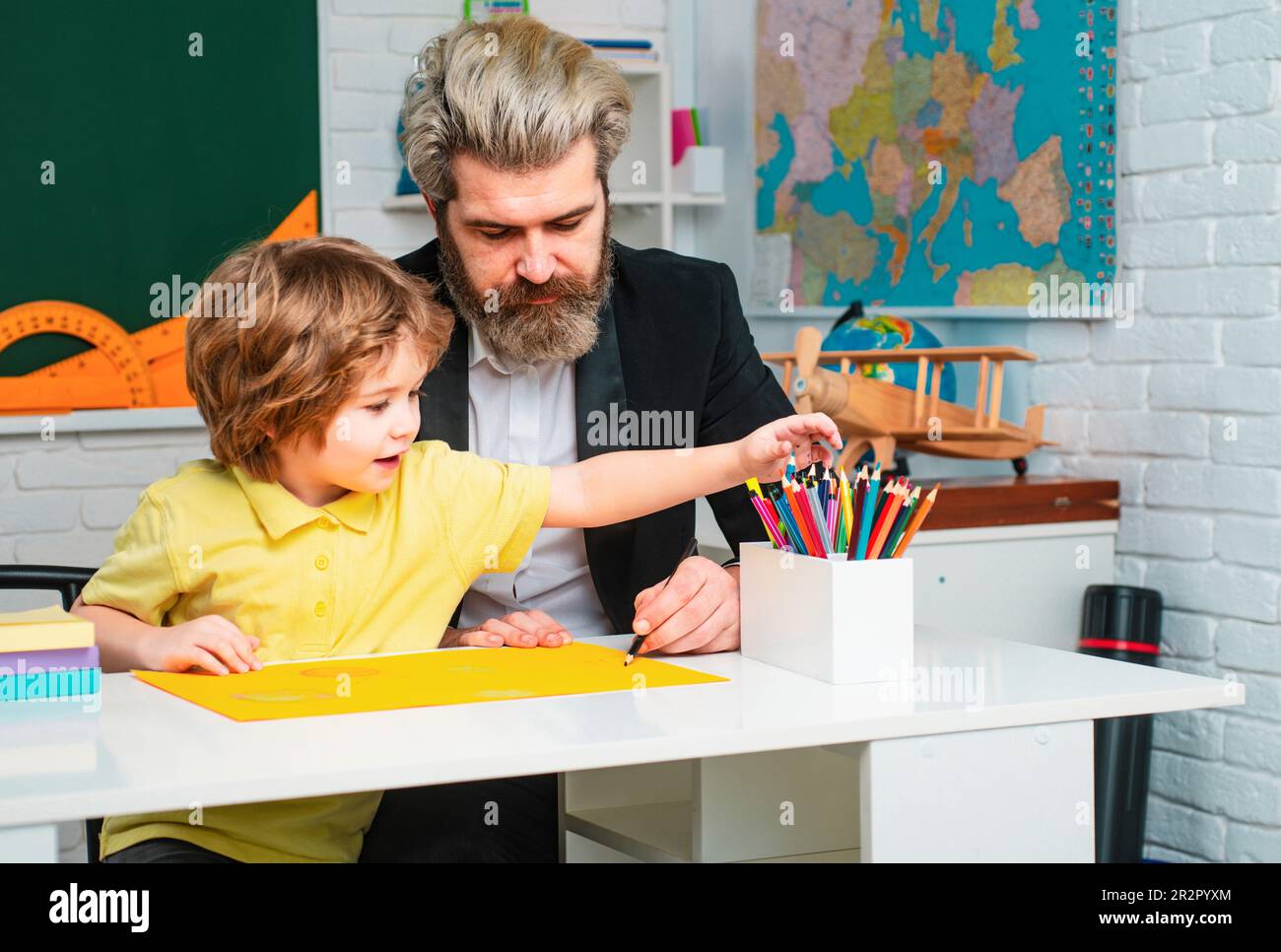 Child home studying and home education. Home teacher or homework tutor ...