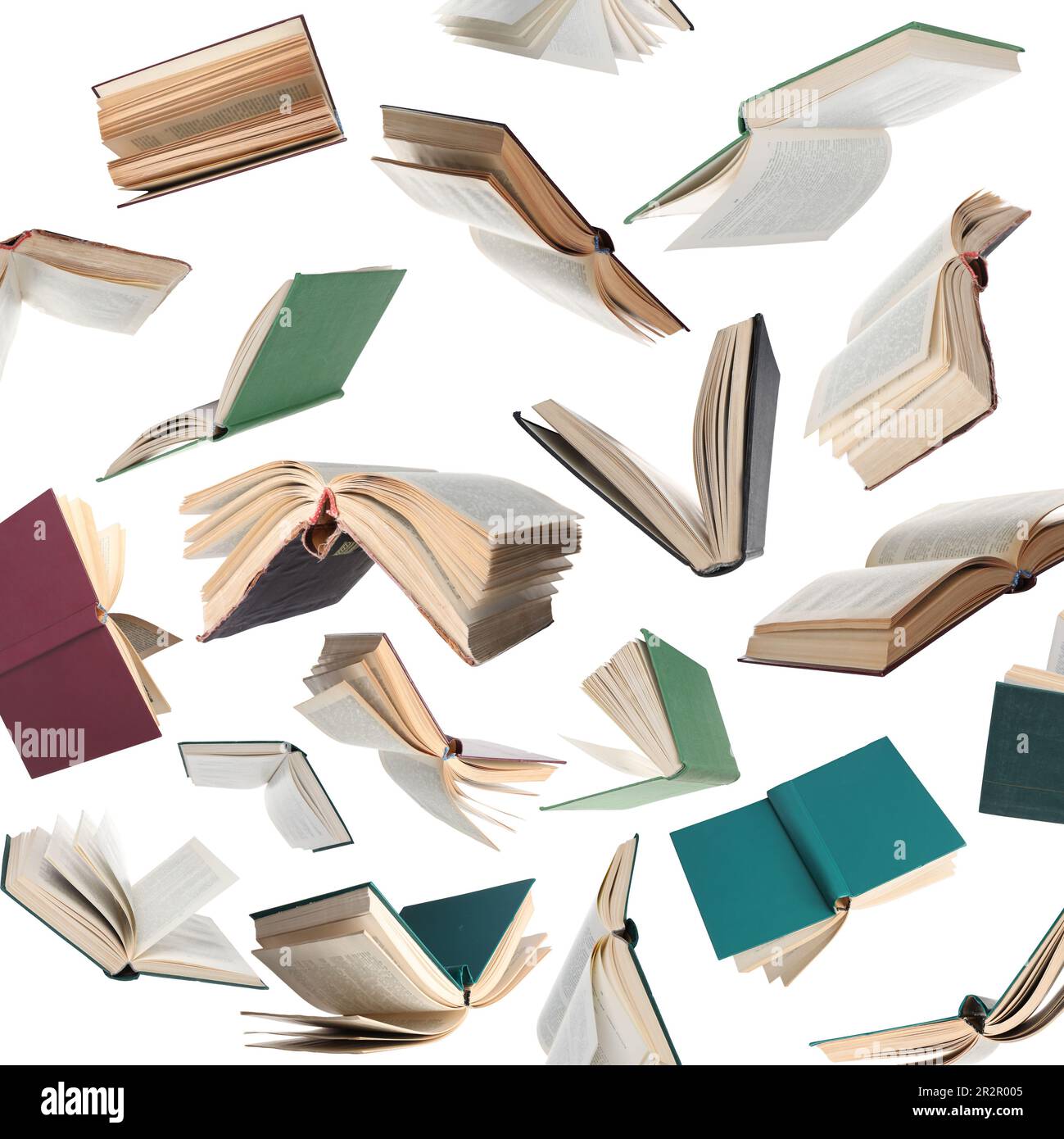 Many hardcover books falling on white background Stock Photo - Alamy