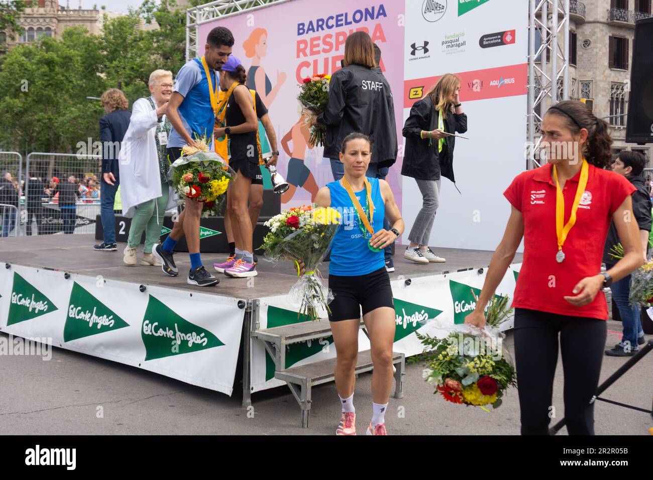 Winners accepting their medals after the city-sponsored marathon in ...