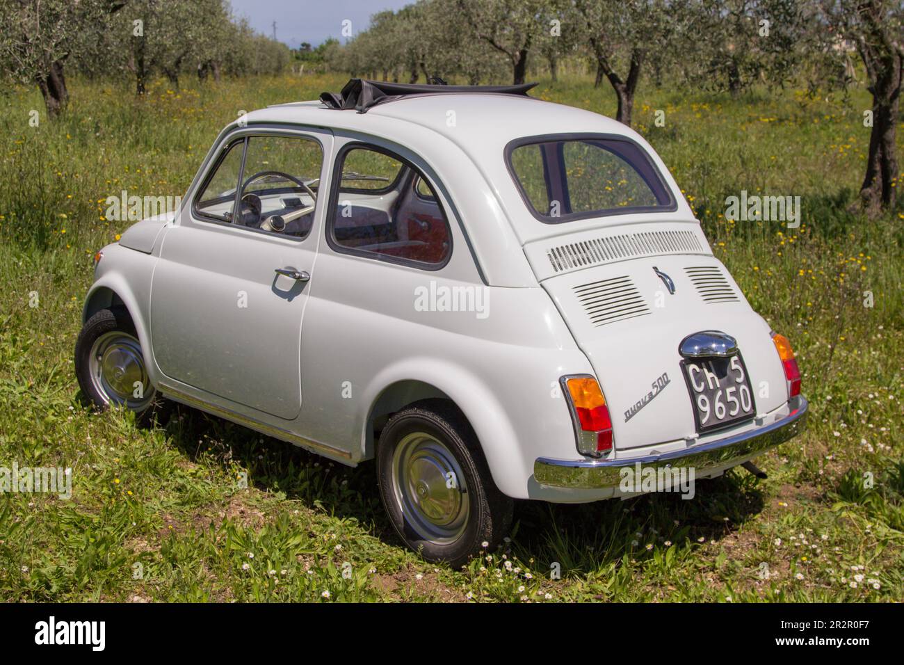 Image of an old vintage Italian Fiat 500 car parked in the middle of a ...