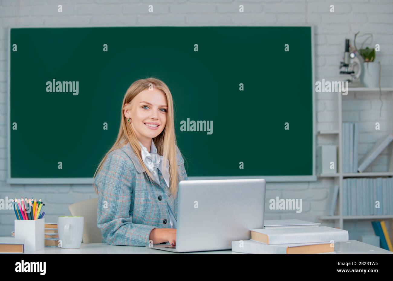 Student preparing exam and learning lessons in school classroom on ...
