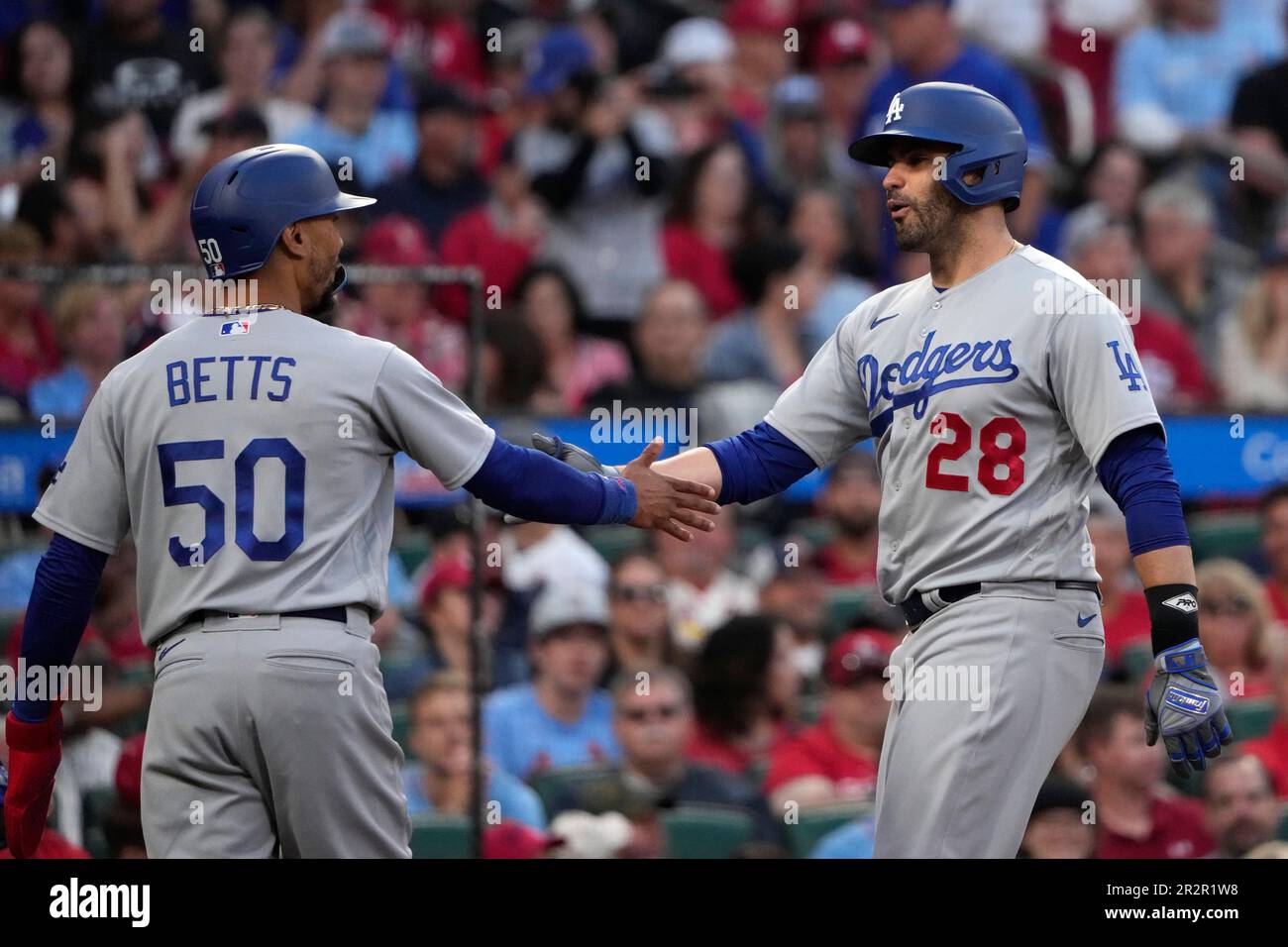 Los Angeles Dodgers' J.D. Martinez is congratulated by teammate Mookie ...