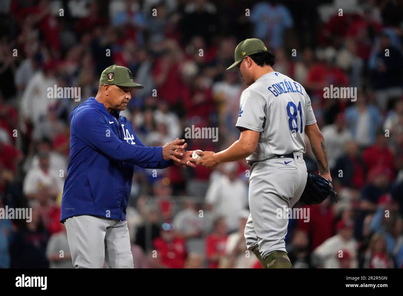 Los Angeles Dodgers relief pitcher Victor Gonzalez (81) is removed by ...