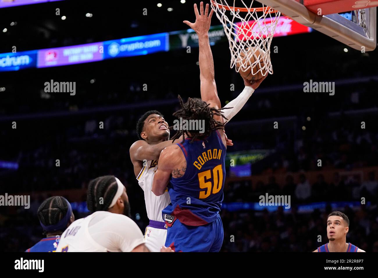 Los Angeles Lakers forward Rui Hachimura shoots over Denver Nuggets forward Aaron Gordon in the ...