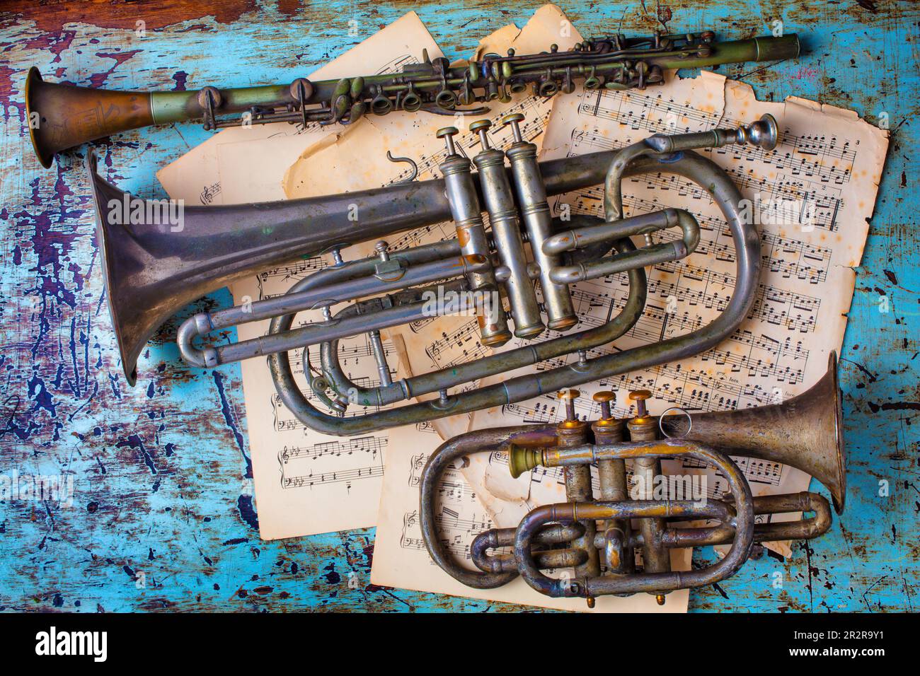 Three Rustic Horns On Sheet Music On Old Weathered Table Still Life ...