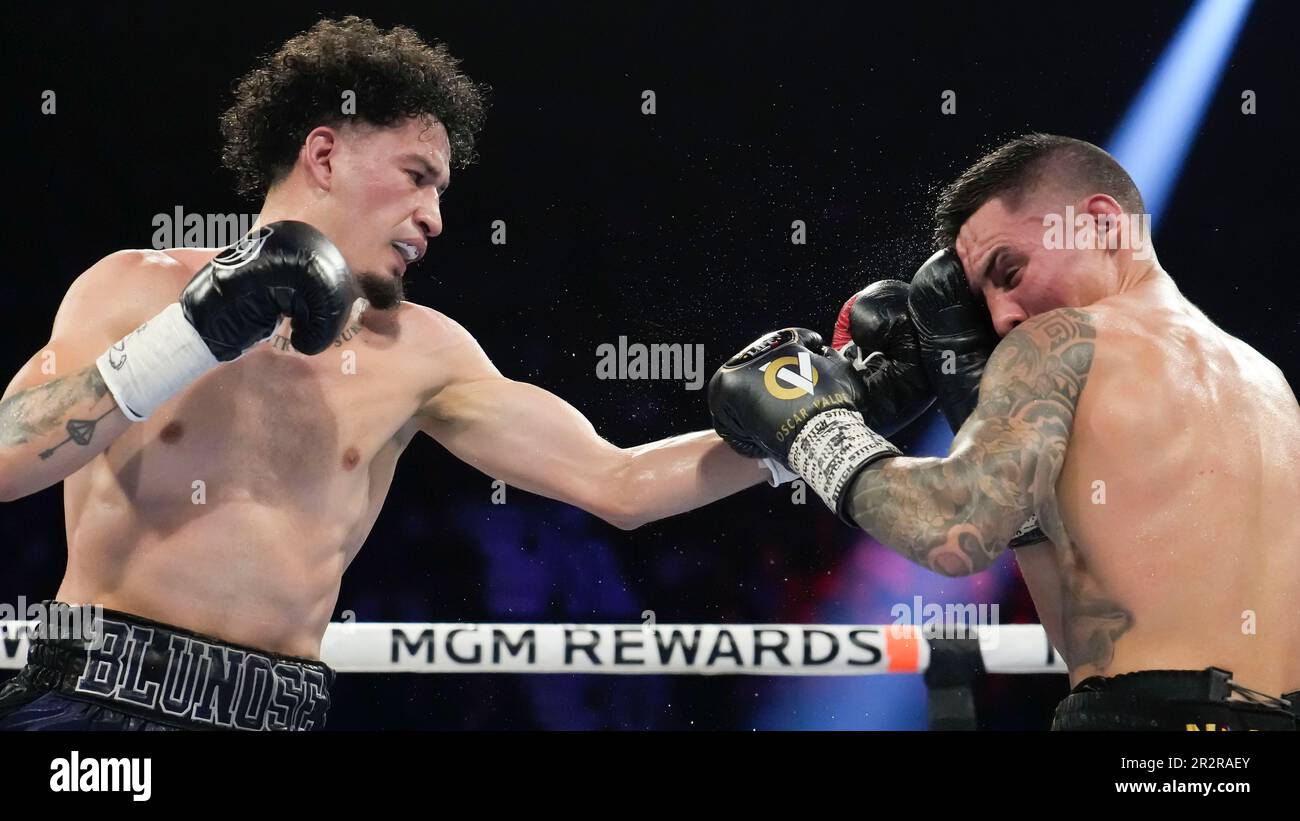 Adam Lopez, left, fights Oscar Valdez in a junior lightweight boxing ...
