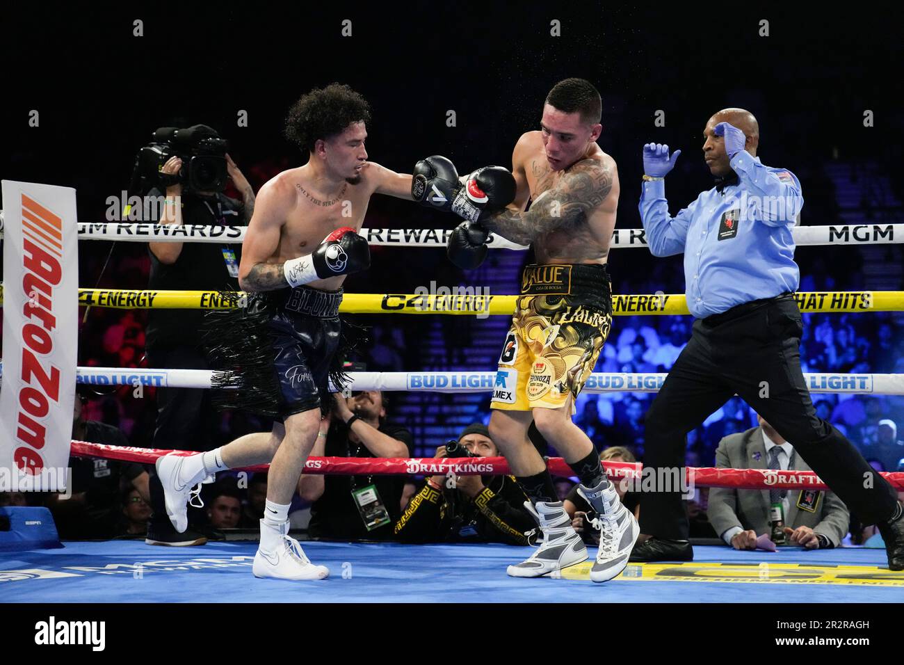 Adam Lopez, left, fights Oscar Valdez in a junior lightweight boxing ...