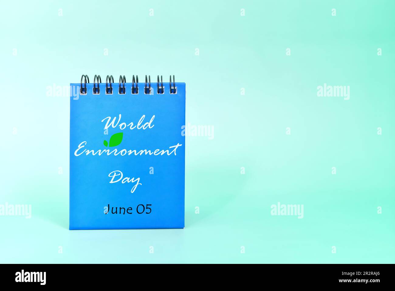 June 5 as World Environment Day date reminder on blue desk calendar ...