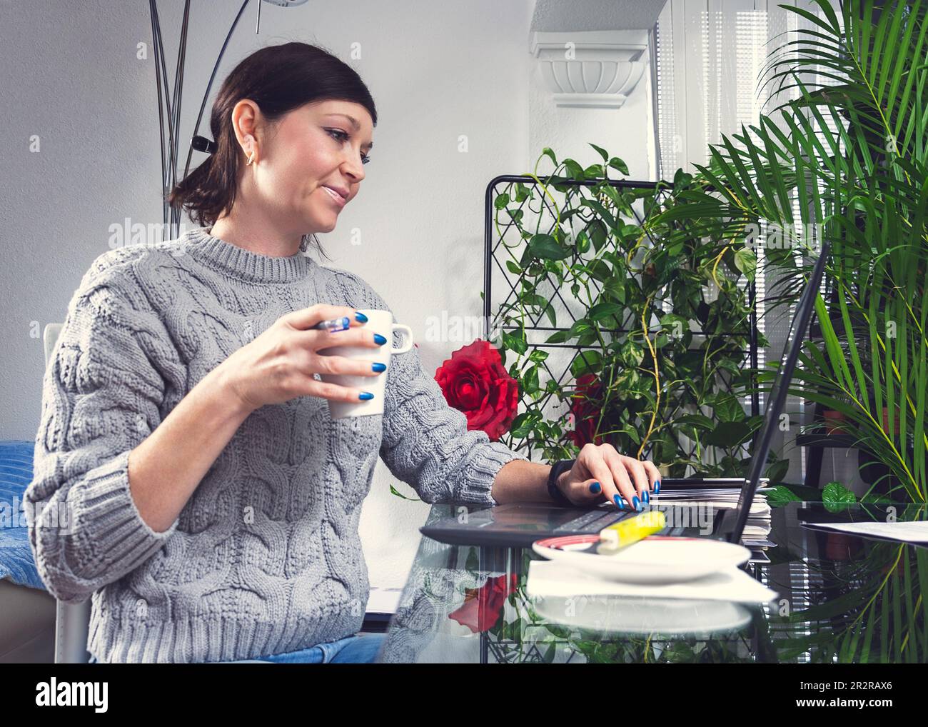 Smiling Beautiful Woman with Laptop Working from the Comfort of her ...