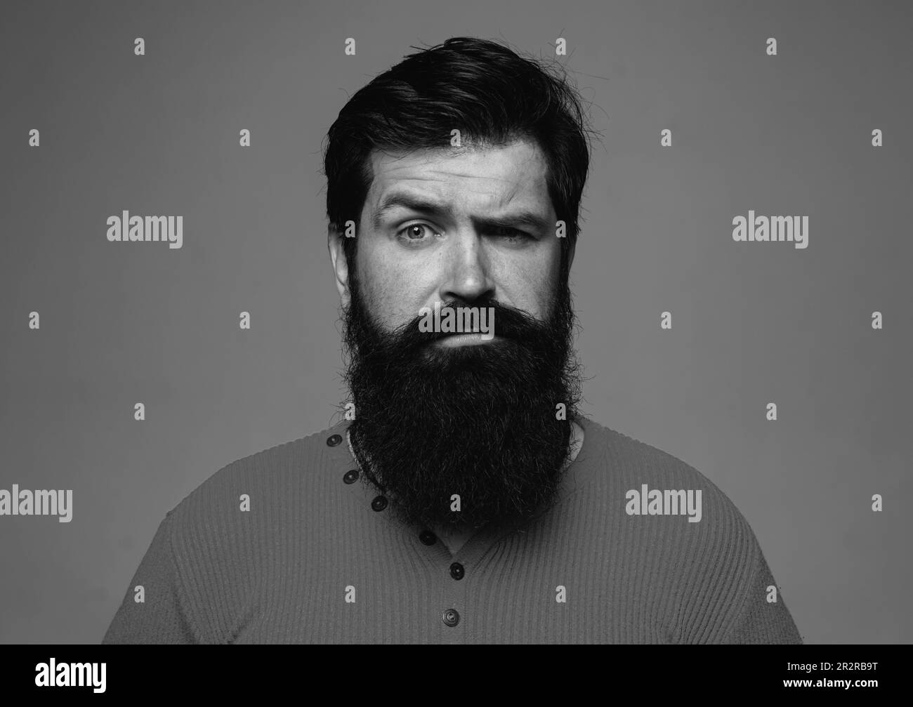 Confident serious man has beard and mustache. Hipster guy models in ...