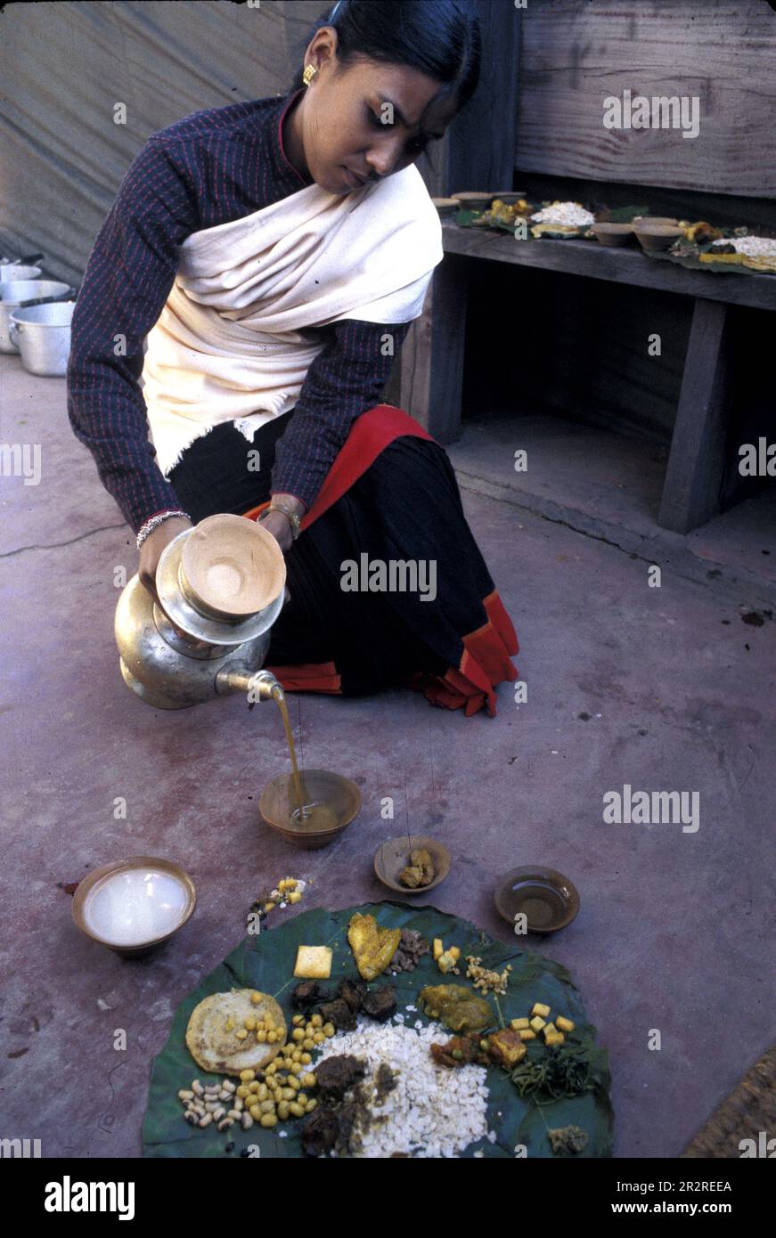 A Newari women preparing puja in Nepal, ethnic group following both ...