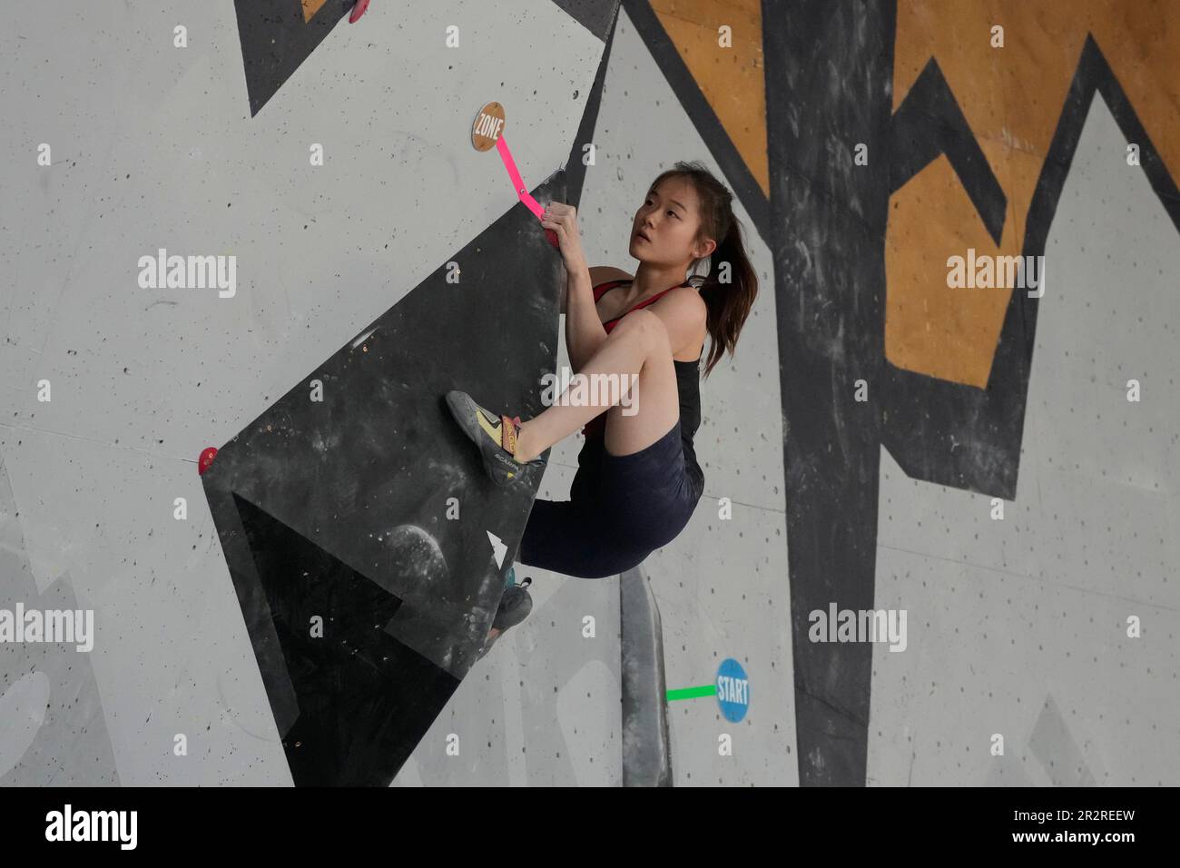 Zhilu Luo, of China, competes during the women's boulder finals at the ...
