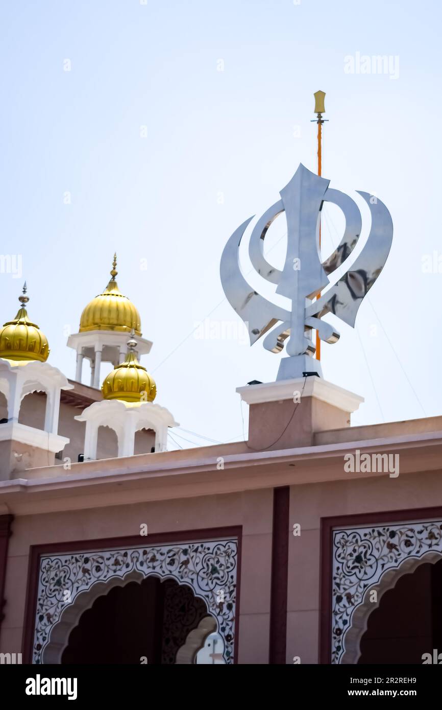 Khanda Sikh holy religious symbol at gurudwara entrance with bright ...