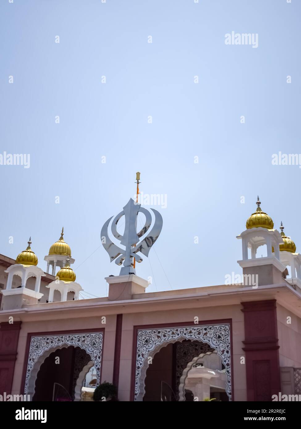 Khanda Sikh holy religious symbol at gurudwara entrance with bright ...