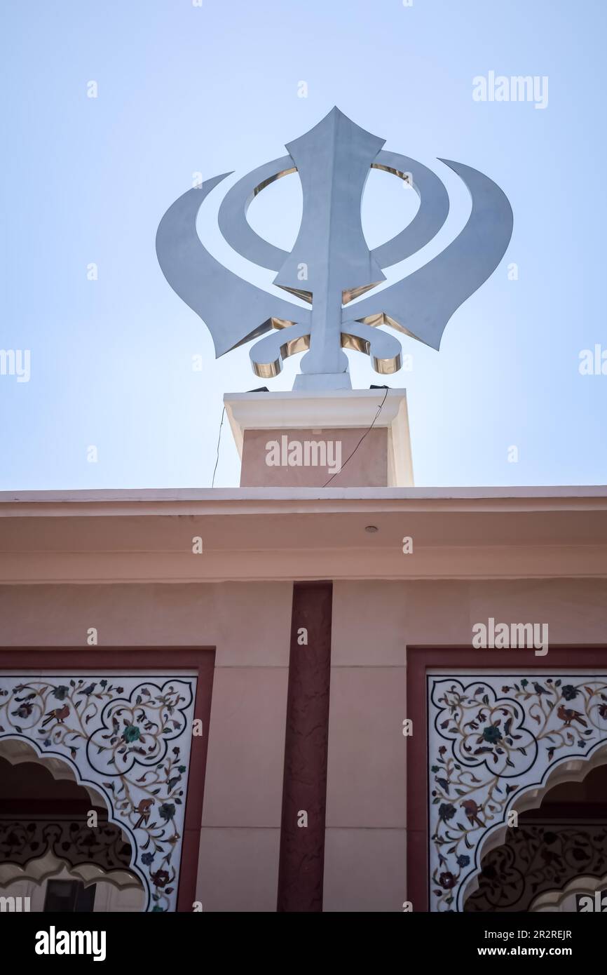 Khanda Sikh holy religious symbol at gurudwara entrance with bright ...